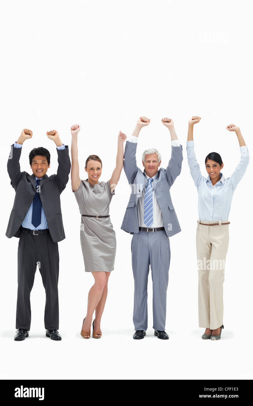 Multicultural business team raising their arms Stock Photo - Alamy