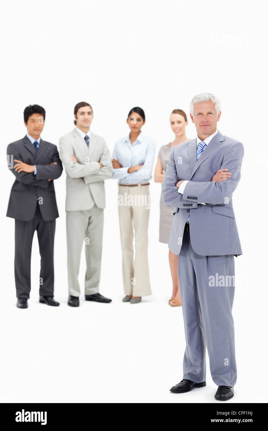 Multicultural business team with their arms folded focus on a mature ...
