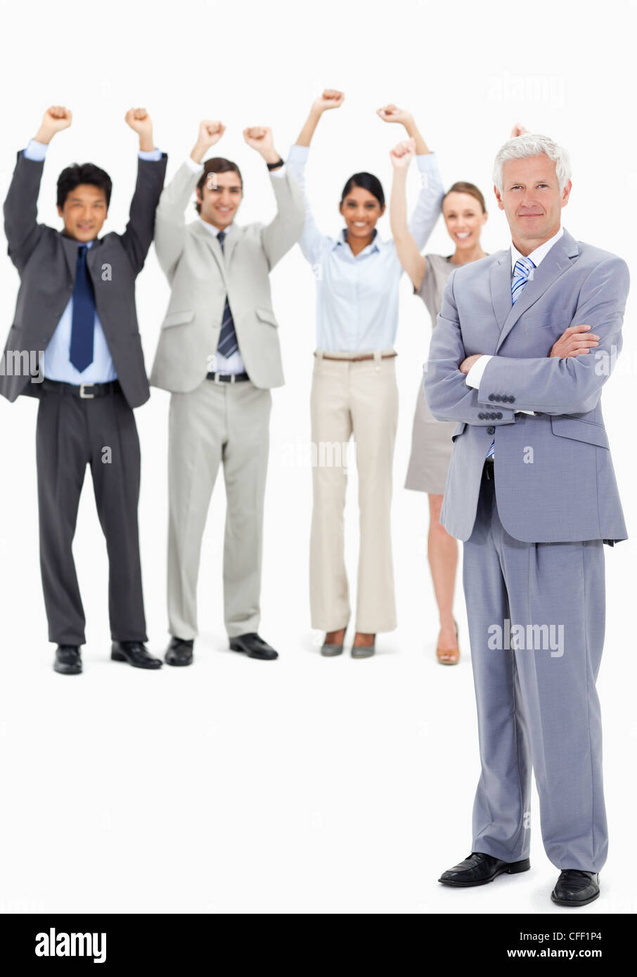 Enthusiastic multicultural business team with a mature man Stock Photo ...