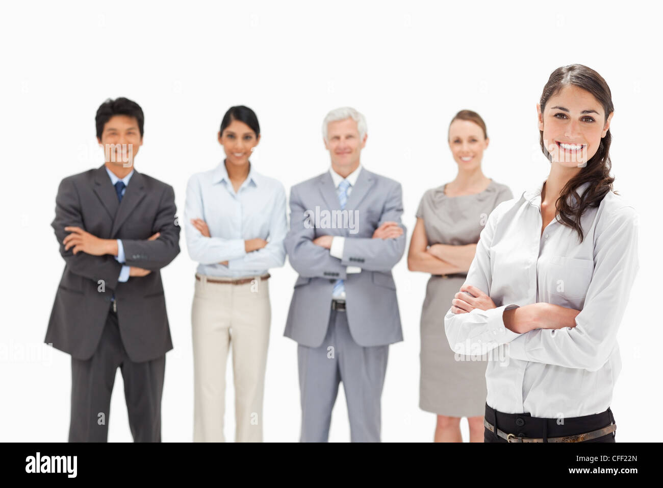 Smiling multicultural business team with their arms folded focus on a ...