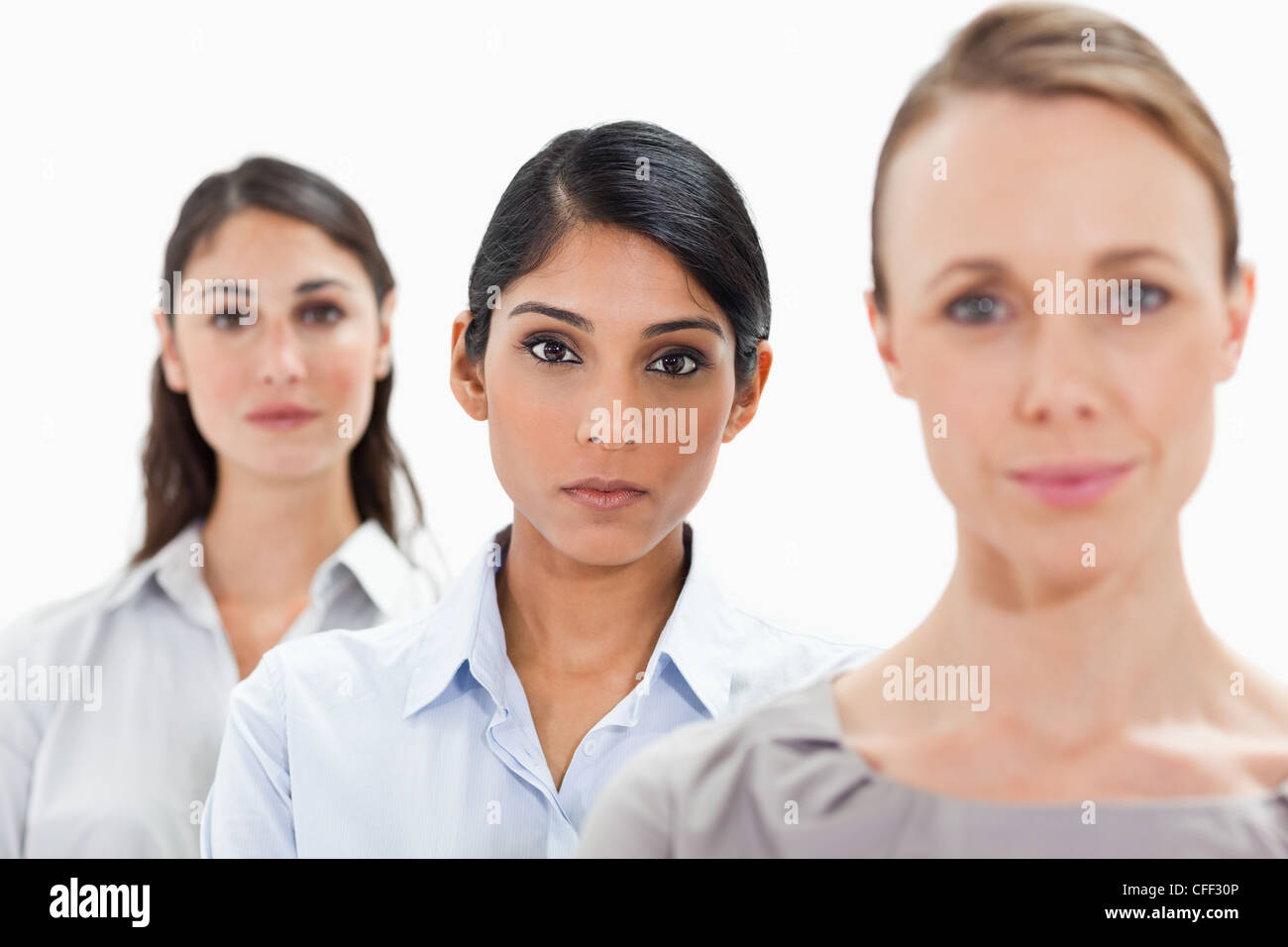 Close-up of businesswomen in a single line with focus on the middle ...