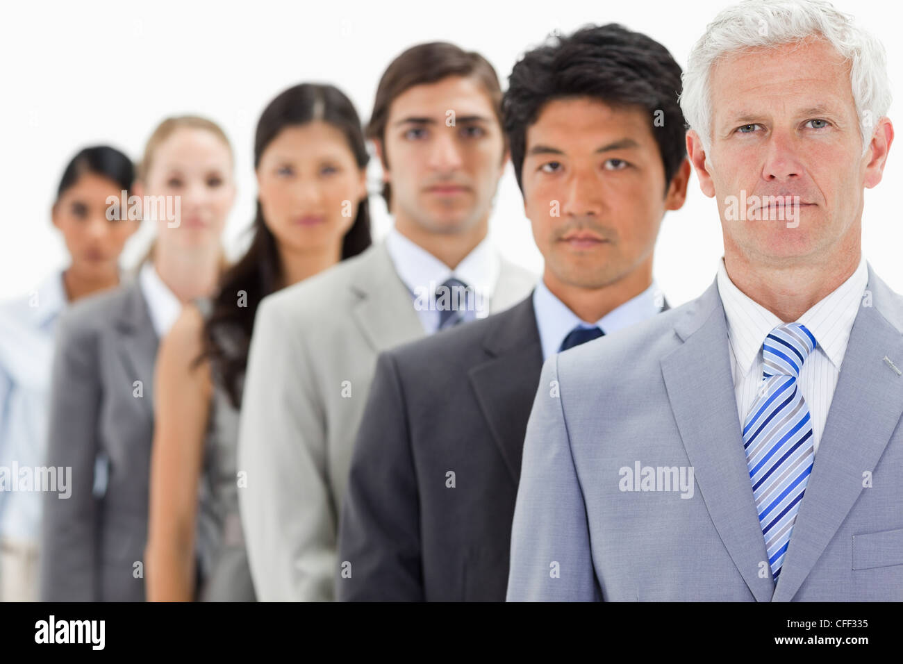Close-up of business people in a single line with focus on the first ...