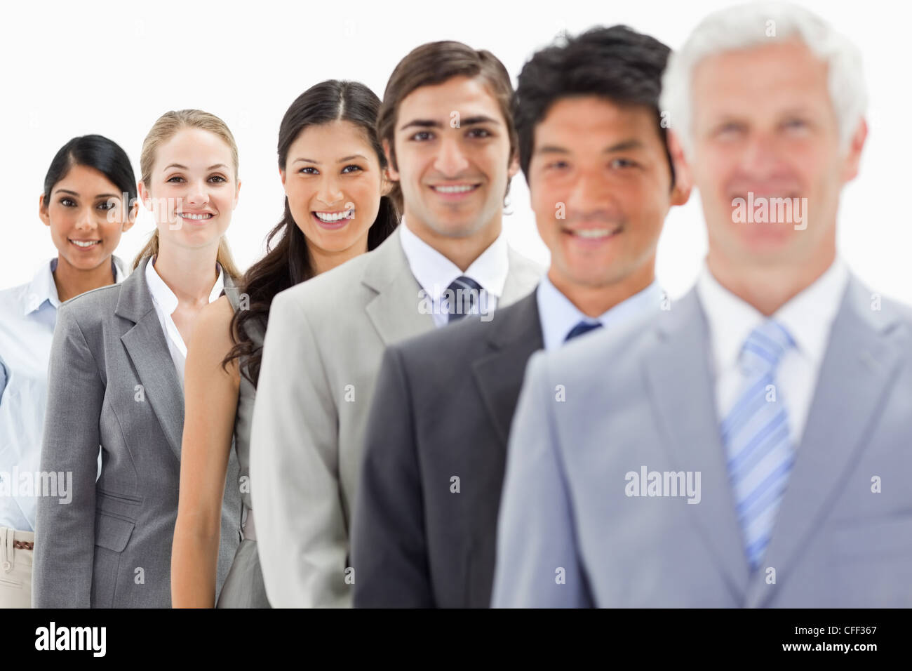 Close-up of smiling business people in a single line with focus on the ...