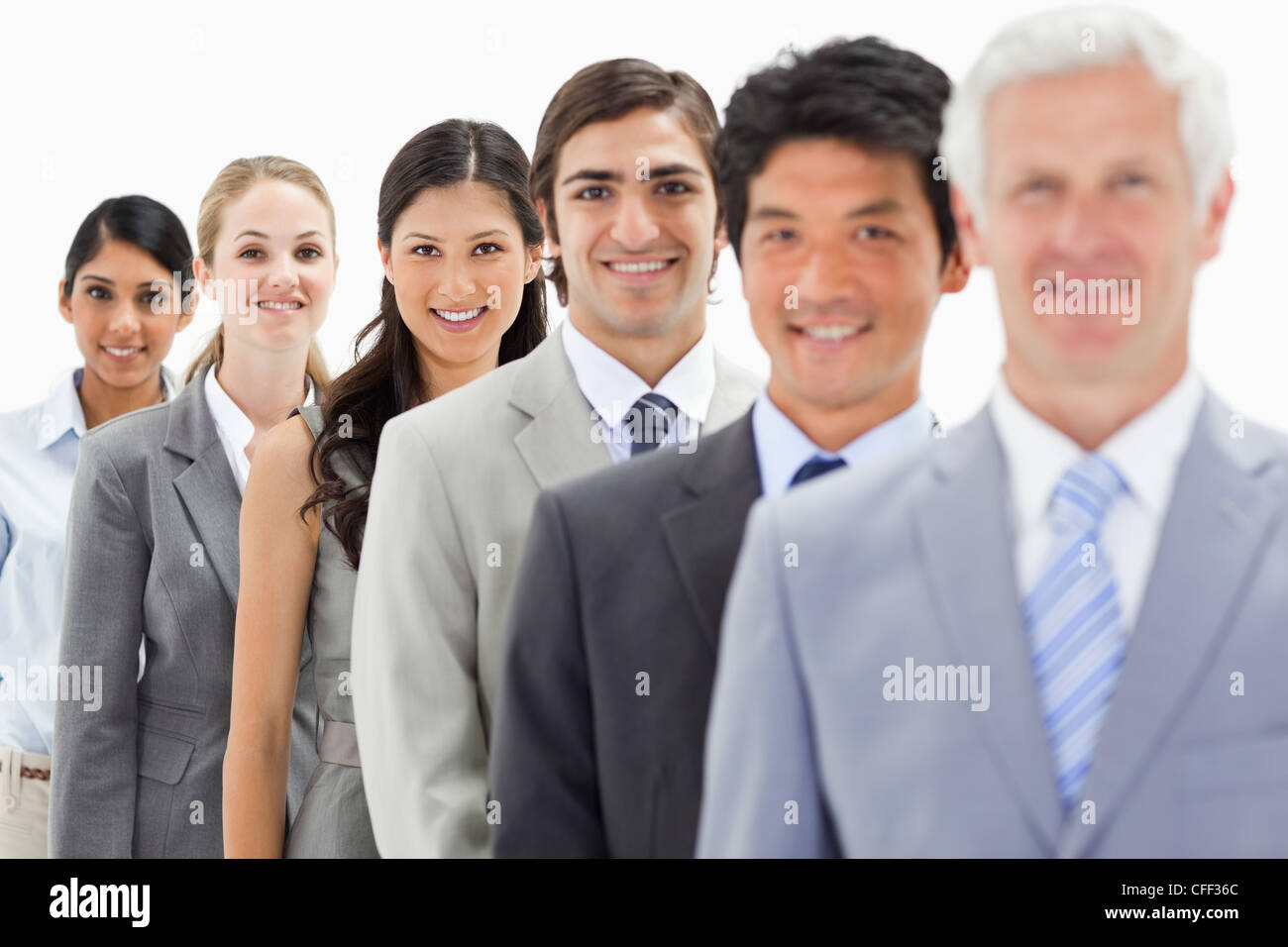Close-up of smiling business people in a single line with focus on the ...
