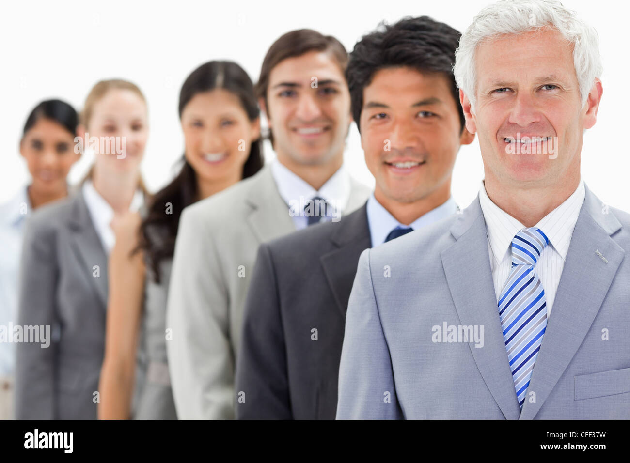 Close-up of smiling business people in a single line with focus on the ...