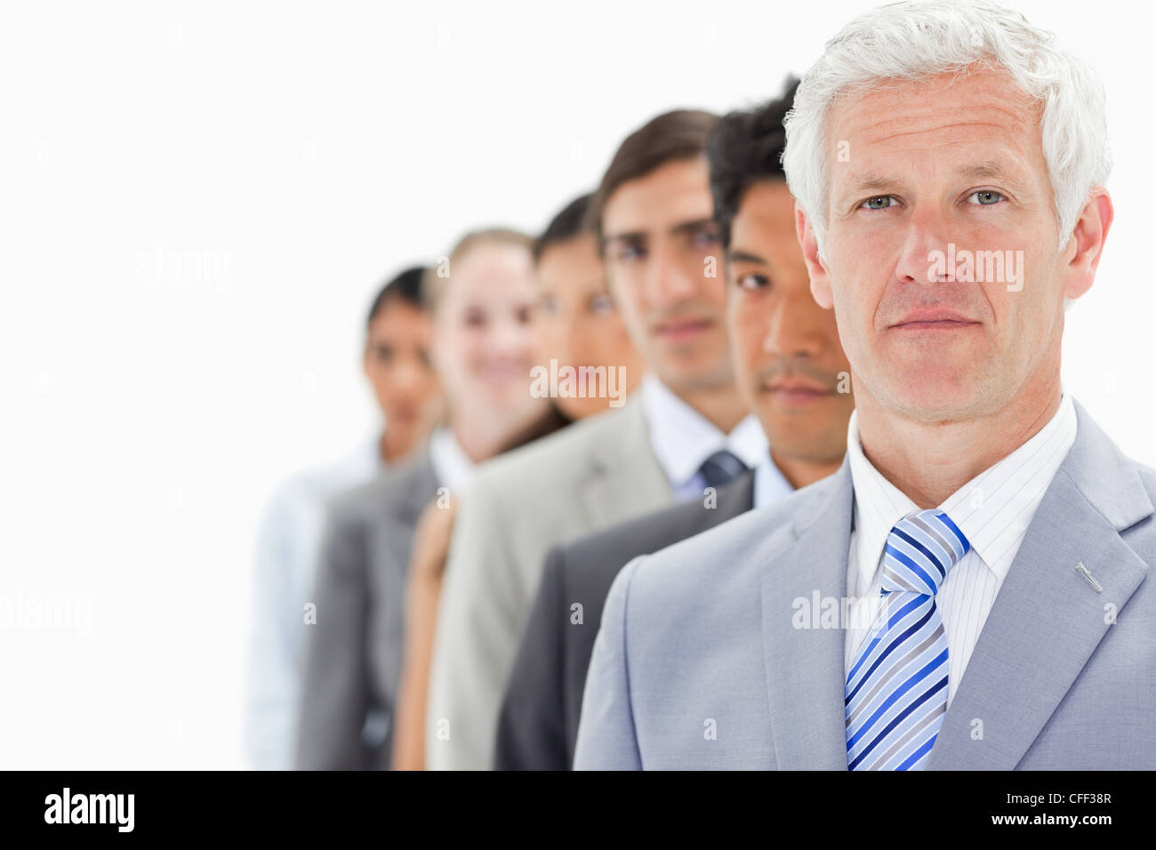 Close-up of a single line of business people with focus on the first ...