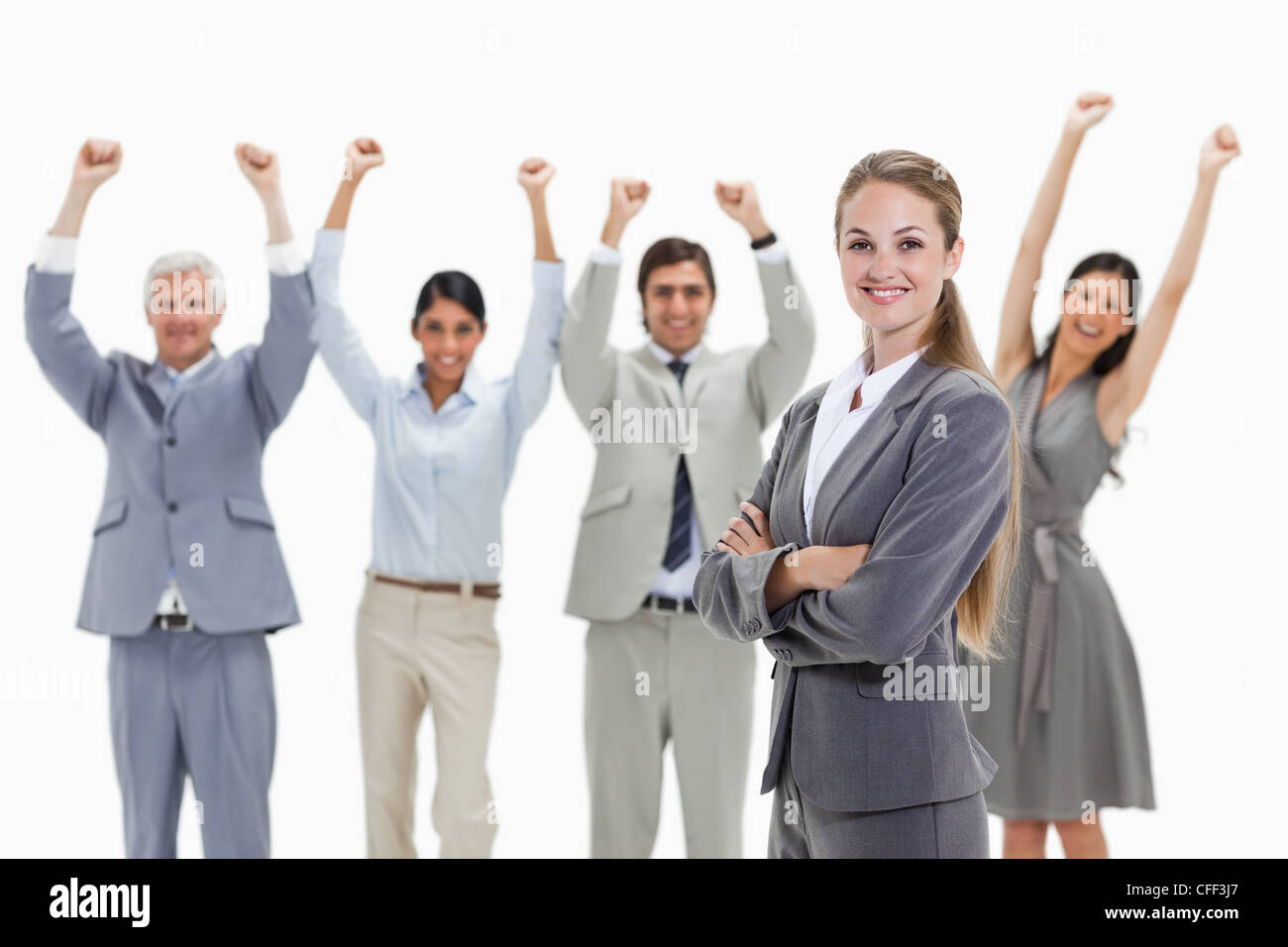 Blonde woman with business people raising their arms Stock Photo - Alamy