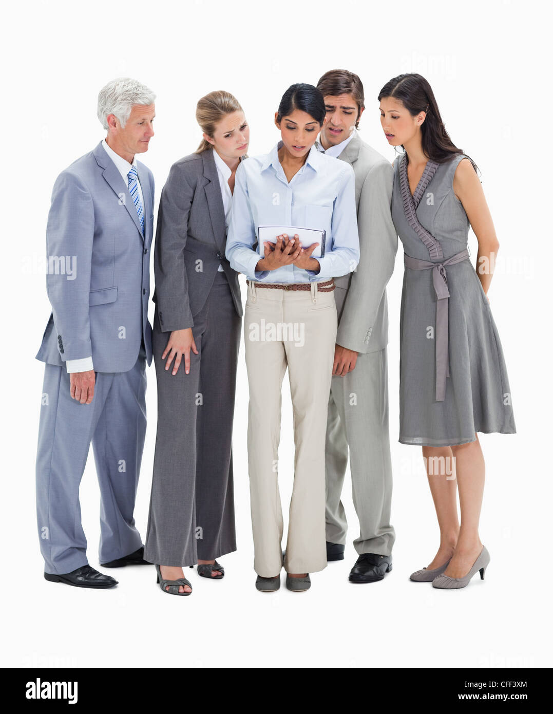 Surprised business people watching a touchpad Stock Photo - Alamy