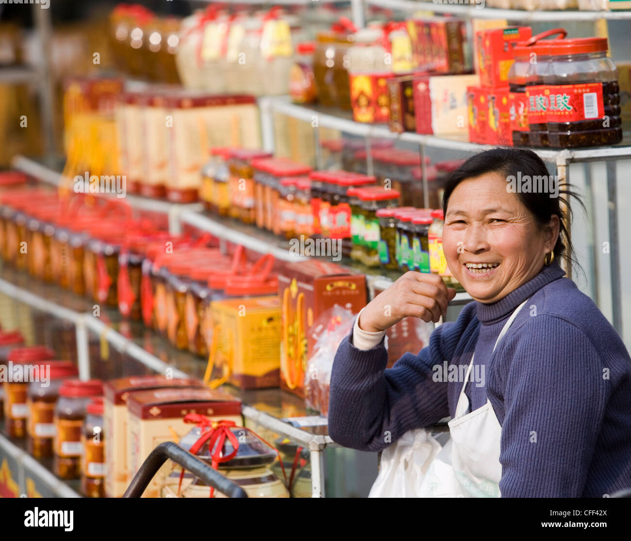 Chinese female street vendor selling packaged food hi-res stock ...