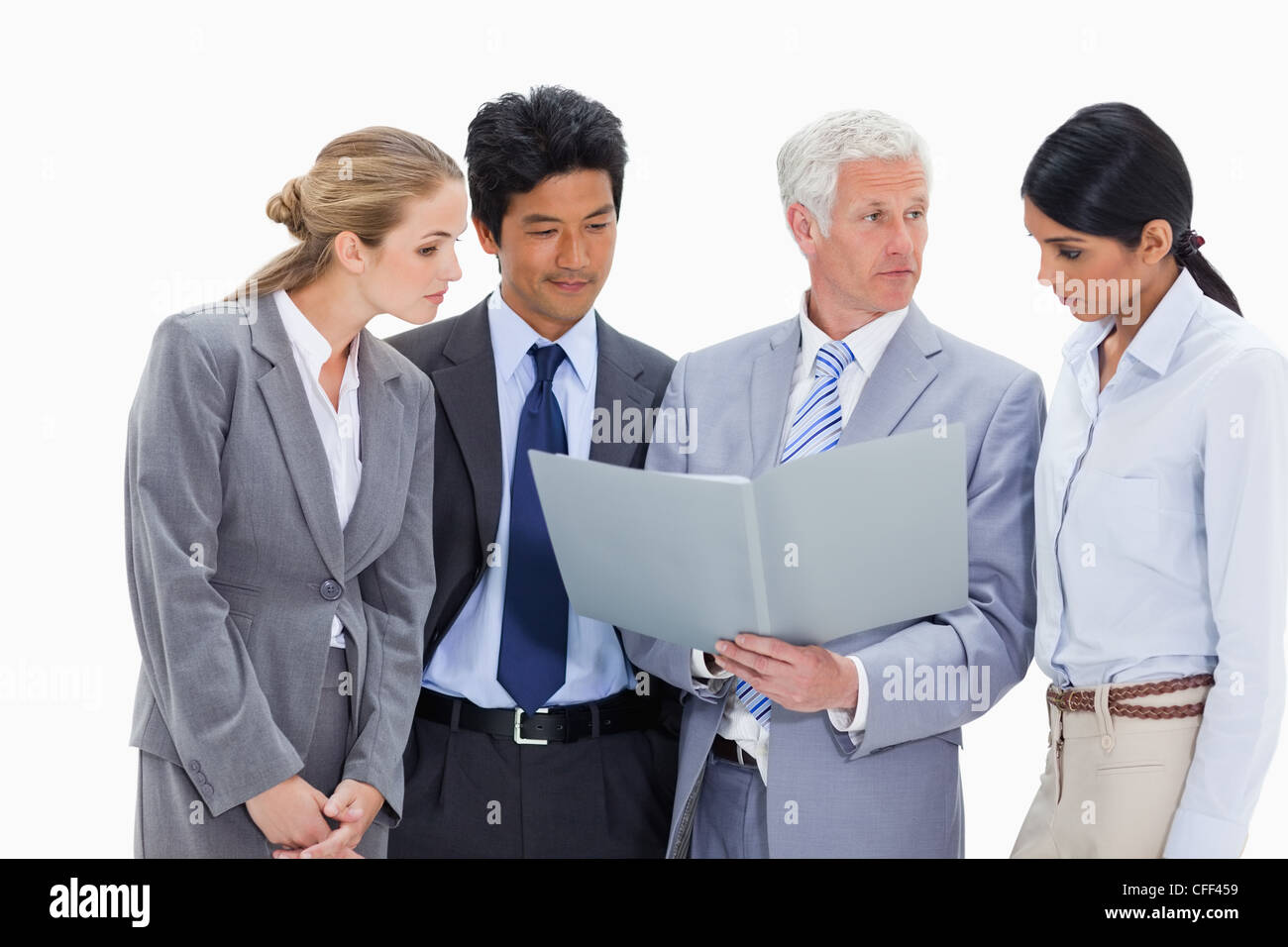 Boss showing a file to his employees Stock Photo - Alamy