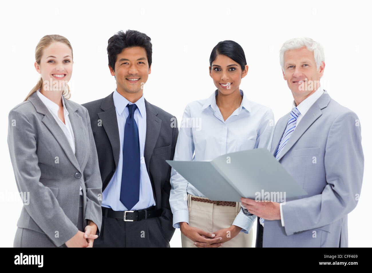 Boss with his smiling employees holding a file Stock Photo - Alamy