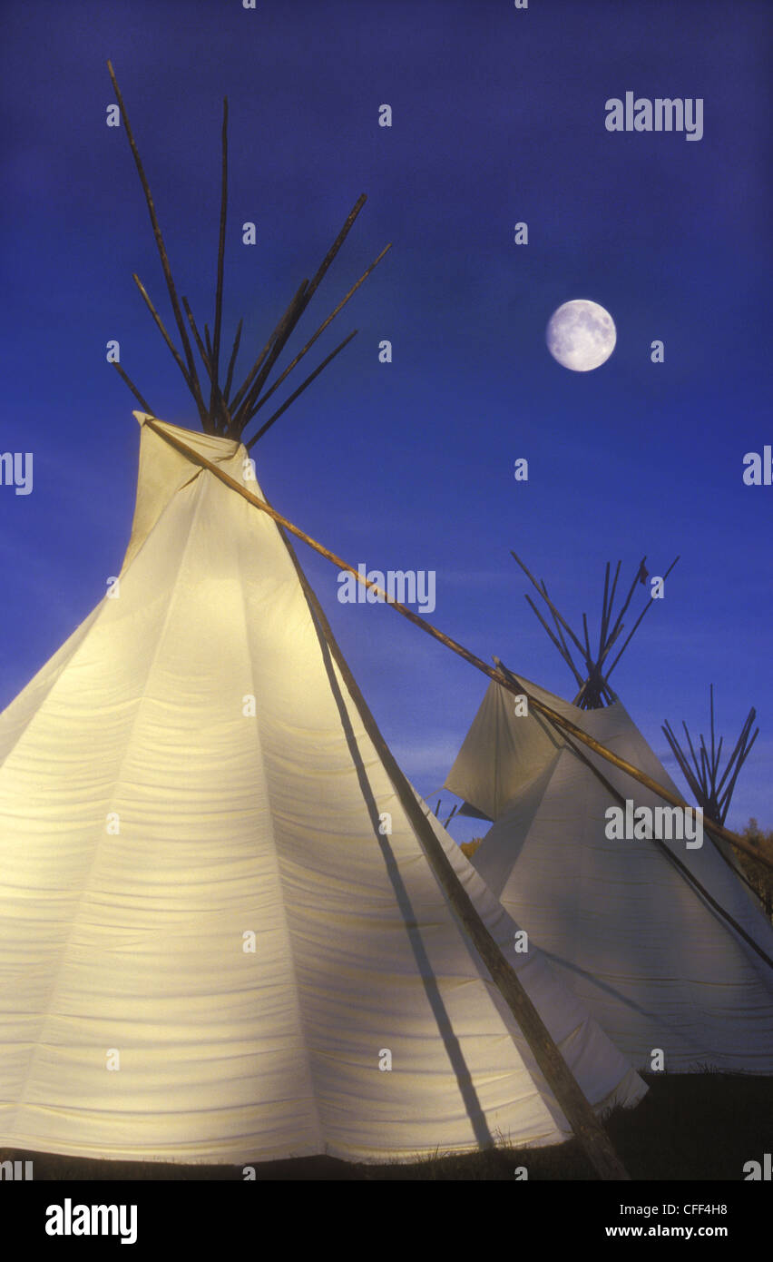 First Nations tee-pee village above the Fraser River at night with full ...