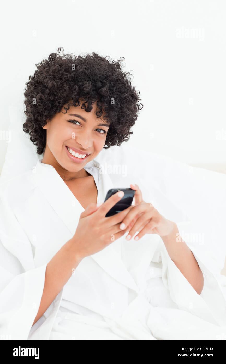 Female smartphone bed Cut Out Stock Images & Pictures - Alamy