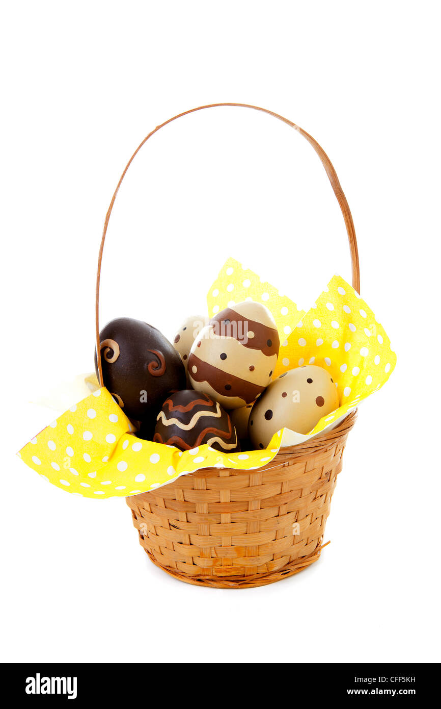 Cane basket with easter eggs over white background Stock Photo - Alamy