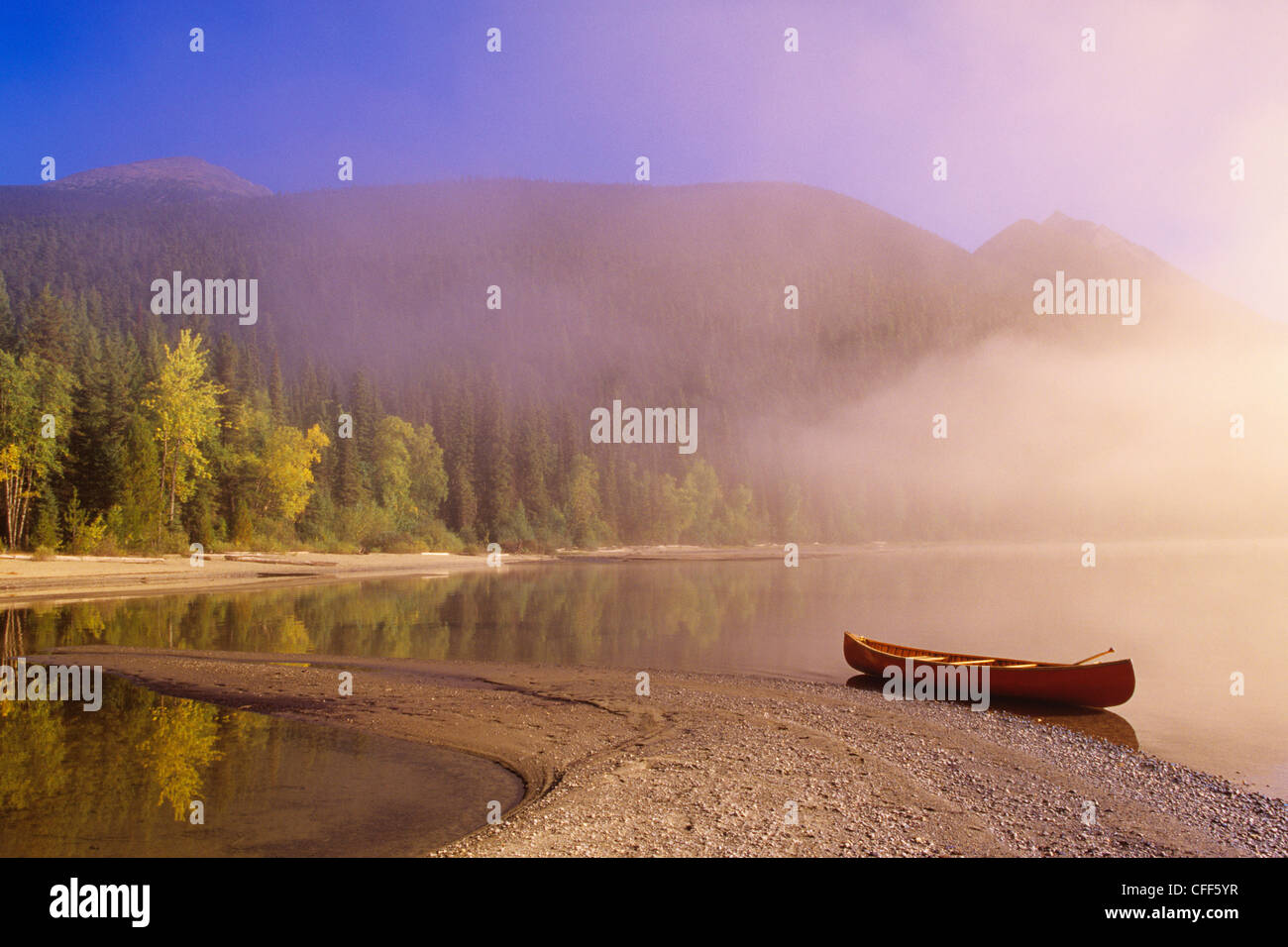 Canoe in mist, Bowron Lake Provincial Park, British Columbia, Canada ...