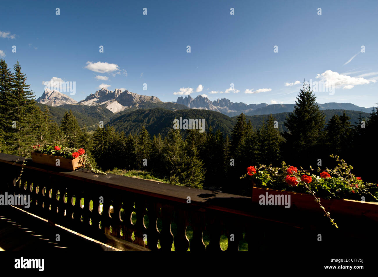 View from a balcony onto mountains in the sunlight, Dolomites, Alto ...