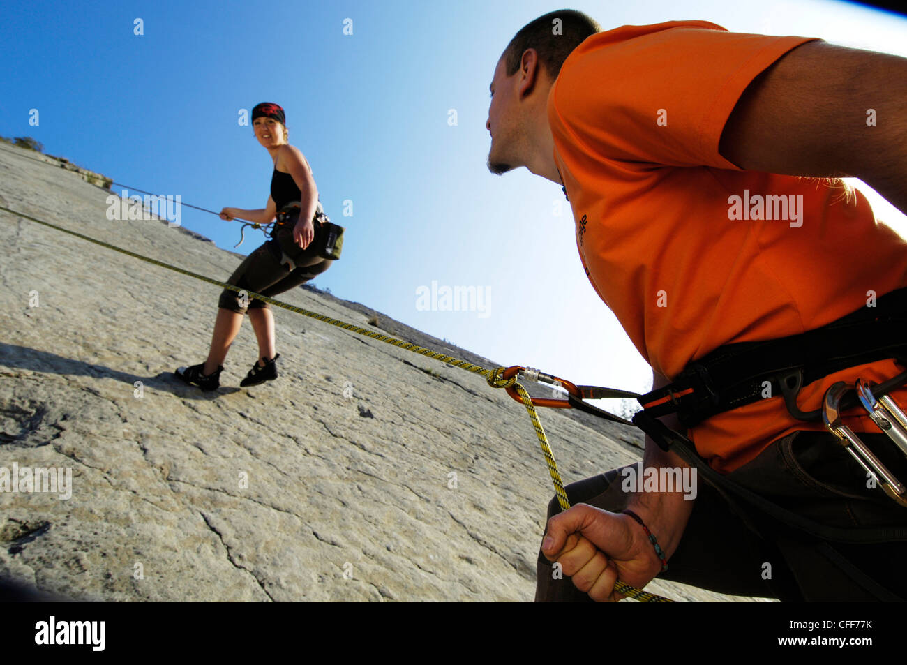 Climber rappelling at a rock wall hi-res stock photography and images ...
