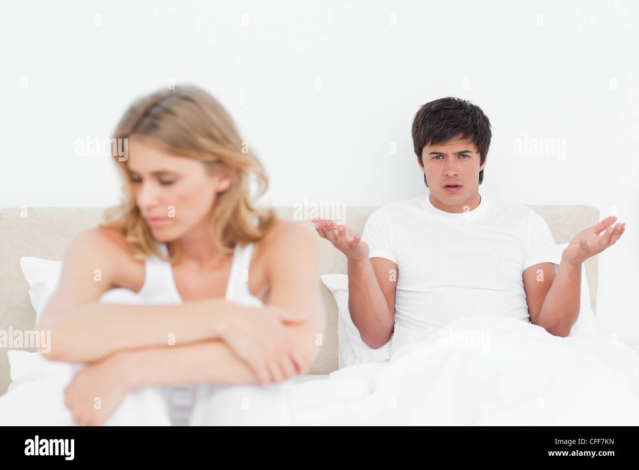 Man looks confused as the woman turns her head away while facing away ...