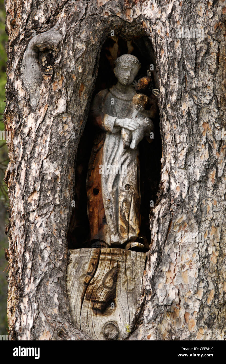 Figure of St. Christopher in a tree trunk, Val Badia, South Tyrol, Alto ...