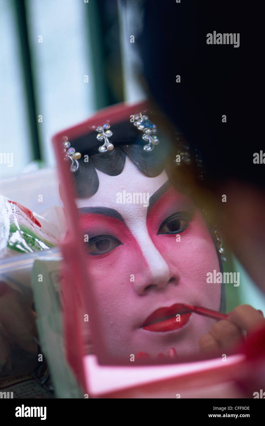 China, Hong Kong, Portrait of Chinese Opera Actress Applying Make-up ...
