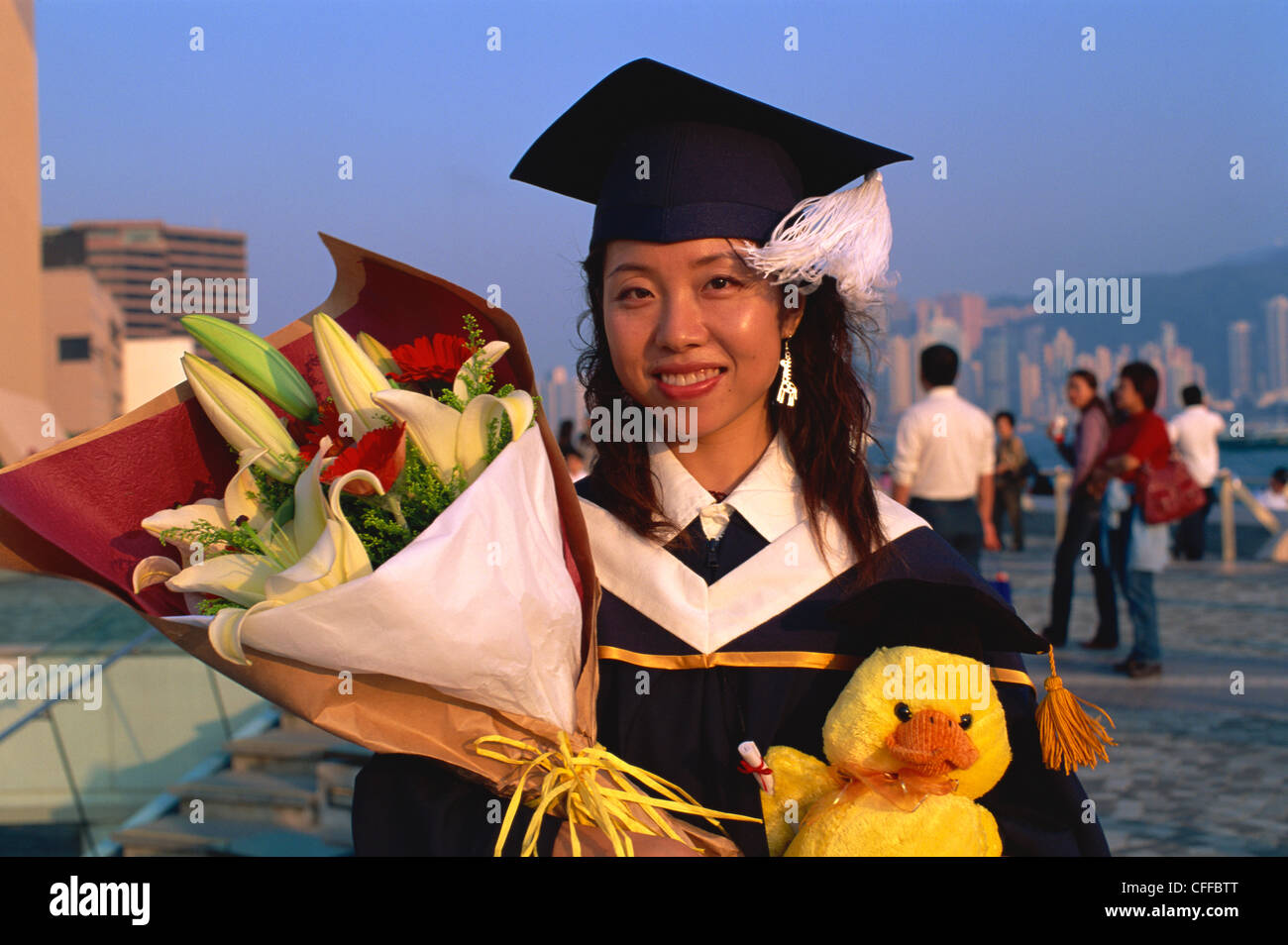 China, Hong Kong, Kowloon, Tsim Sha Tsui, Portrait of Girl Celebrating ...