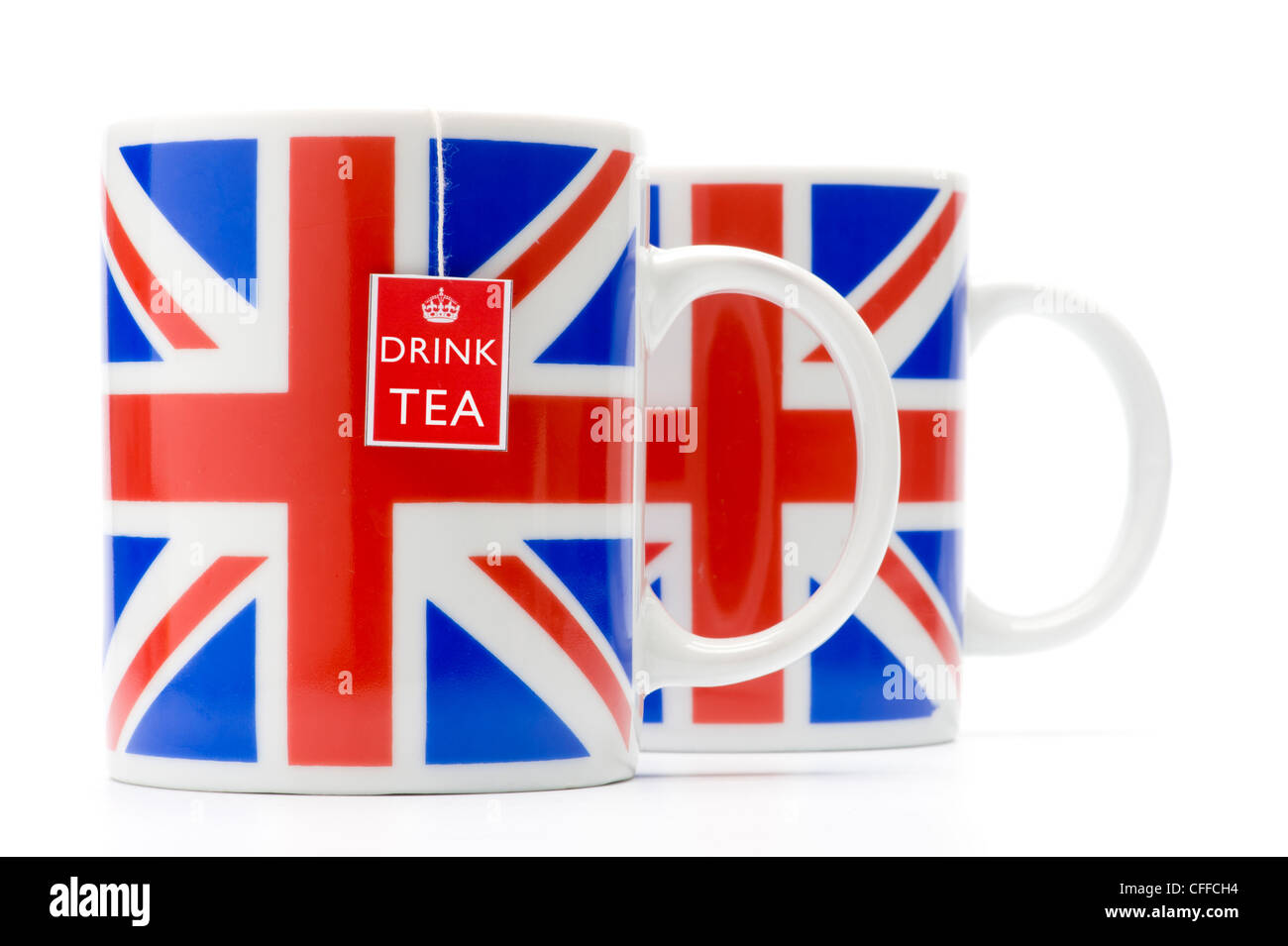 Two Union Jack mugs with teabag string, shot in studio on a white ...