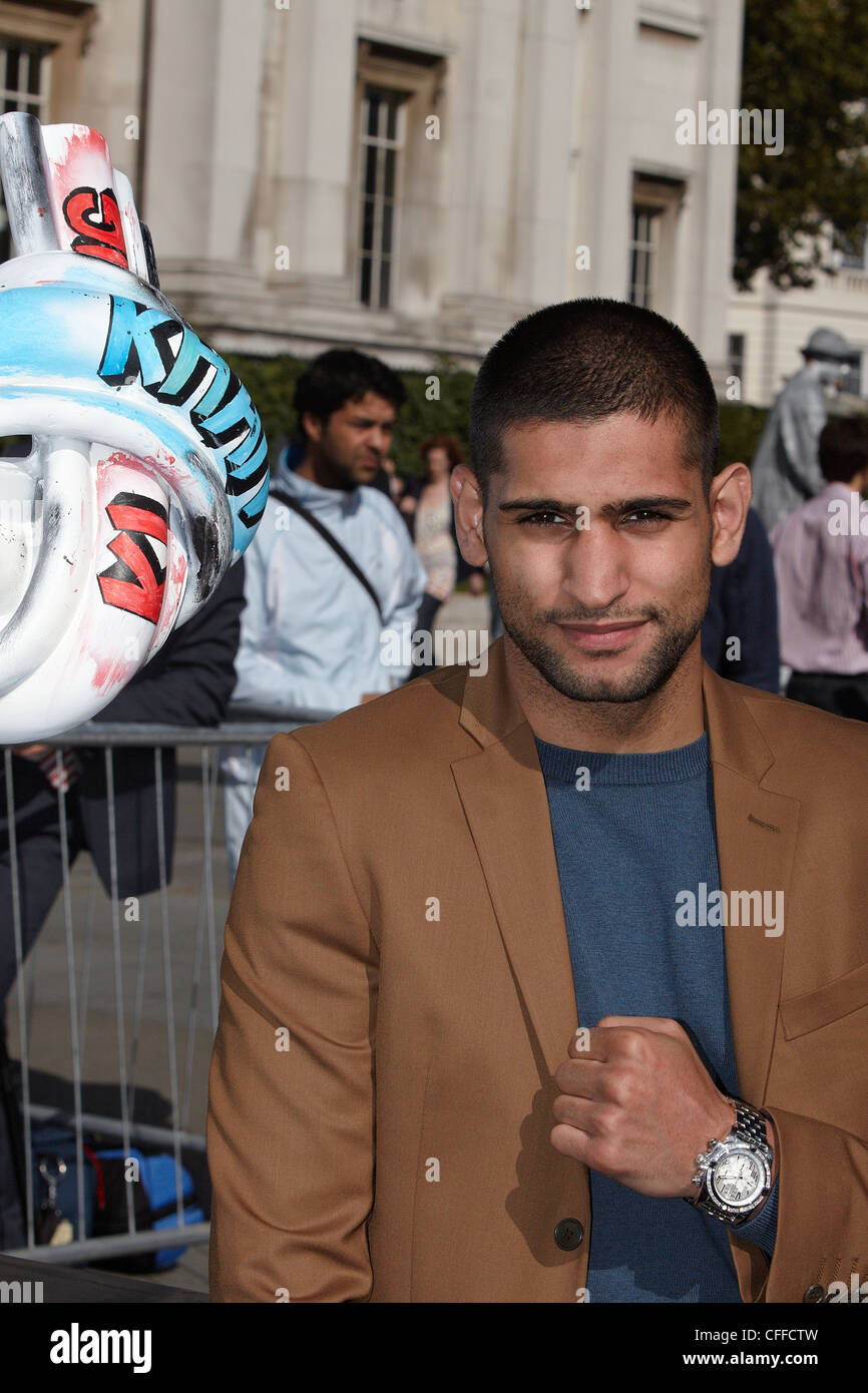 Boxer Amir Khan poses with a sculpture installed in Trafalgar Square as ...