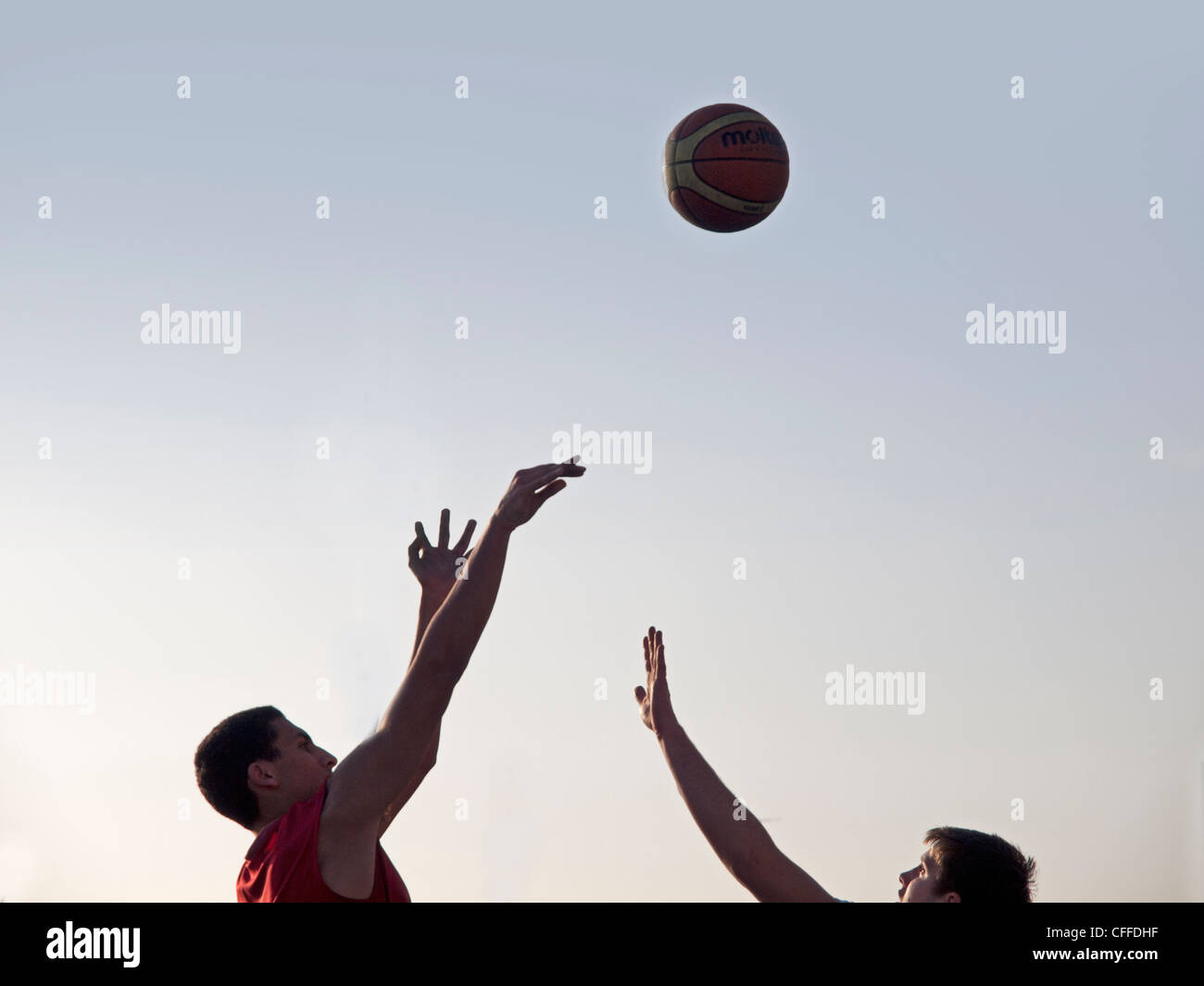 Jumping for a basketball on a Brighton court Stock Photo - Alamy