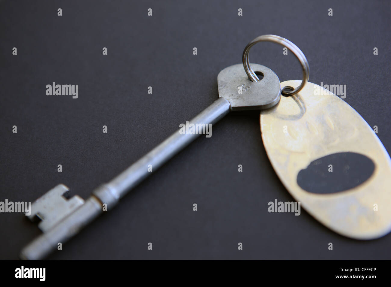 Key against a black background Stock Photo - Alamy