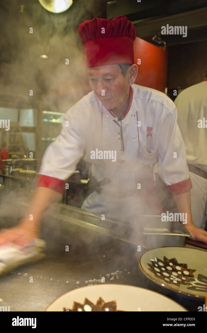 Japanese Restaurant Chef Cleaning Hot Cooking Plate Stock Photo - Alamy