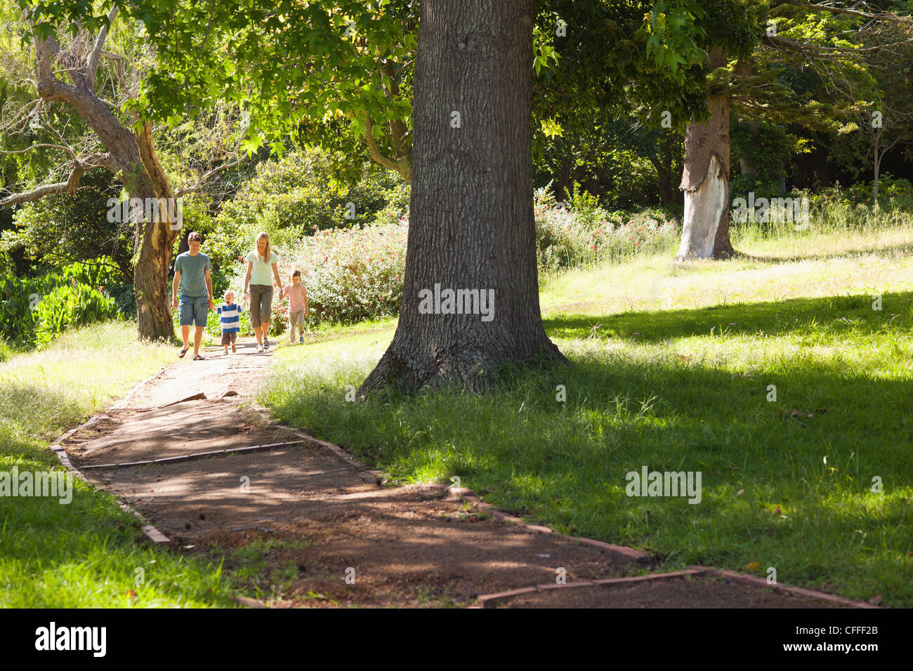 A family walking back towards the camera Stock Photo - Alamy