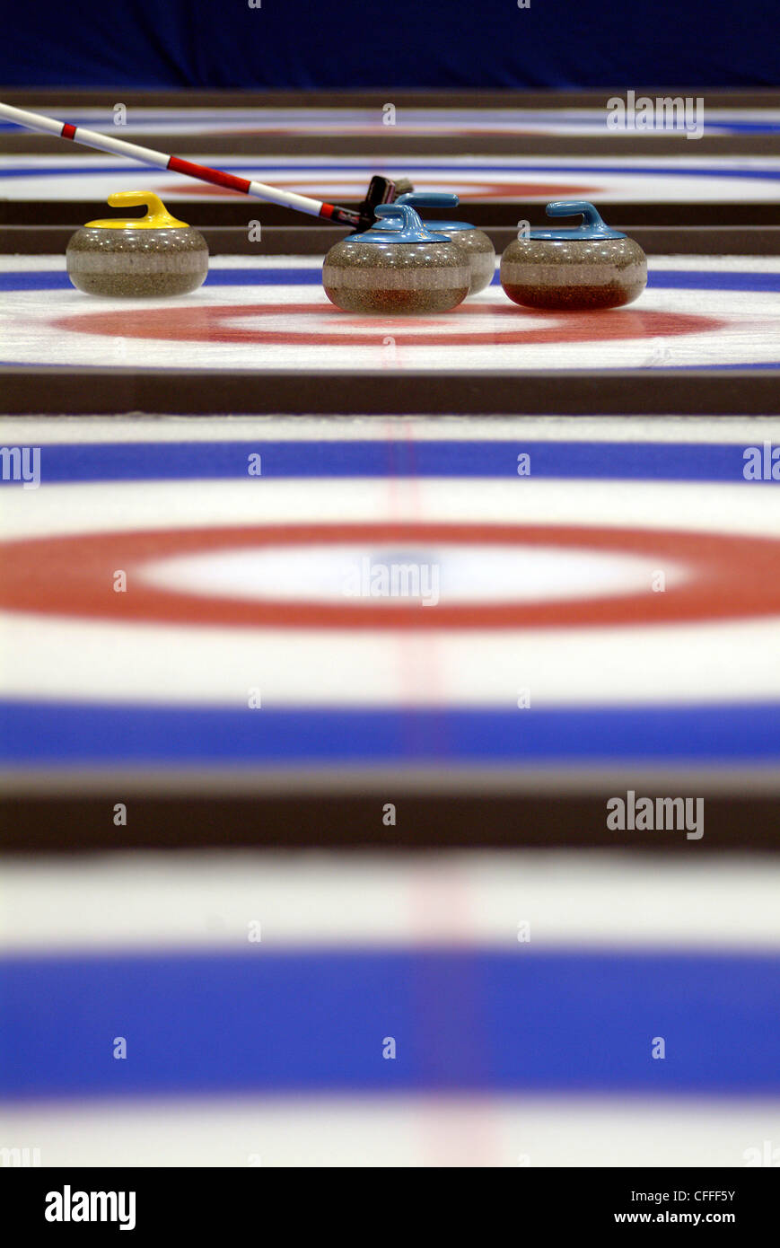 Curling Rocks on Ice Stock Photo - Alamy