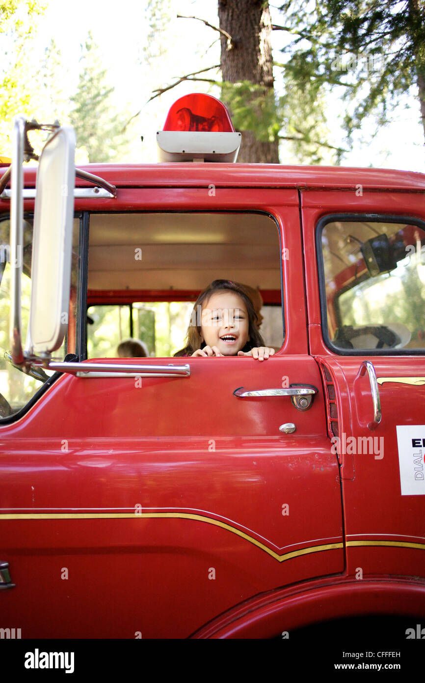 A young girl plays in a fire truck Stock Photo - Alamy