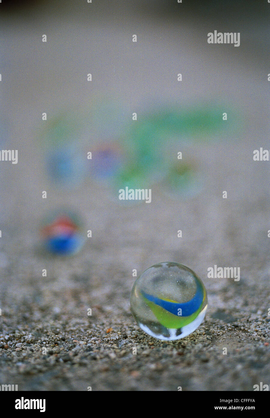 Marbles on Pavement Stock Photo - Alamy