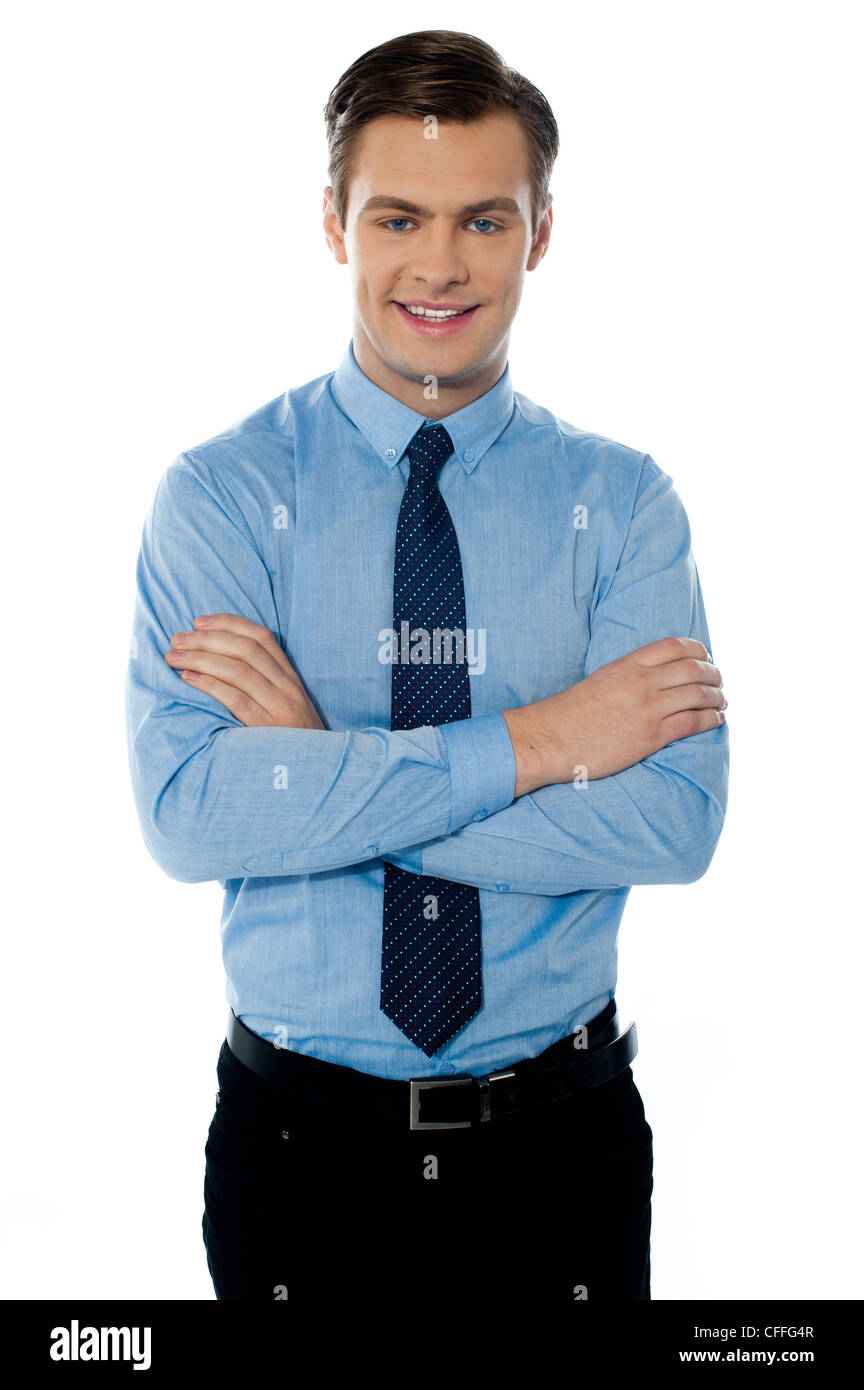 Smiling male businessman with folded arms isolated on white background ...