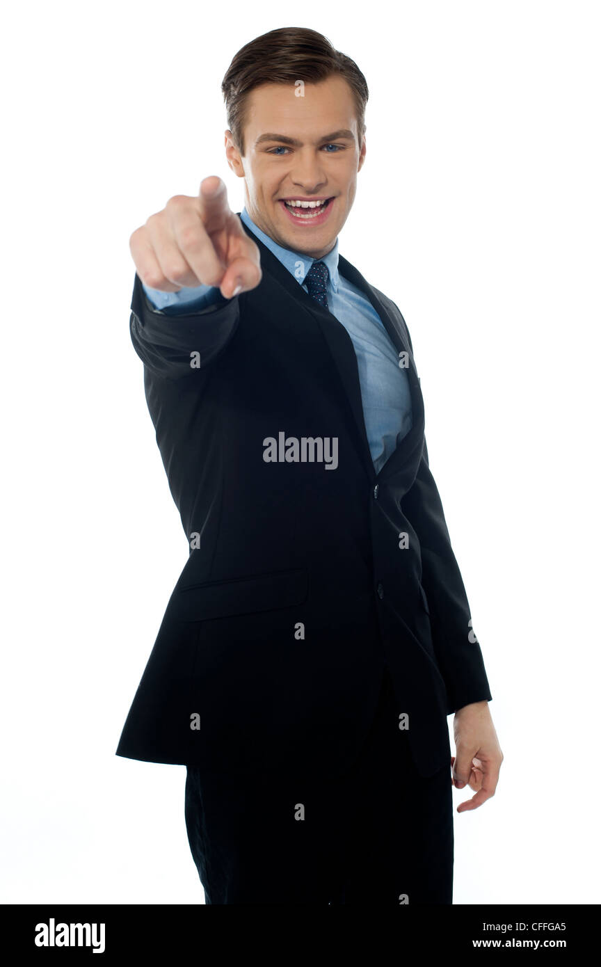 Mature businessman smiling pointing hi-res stock photography and images ...