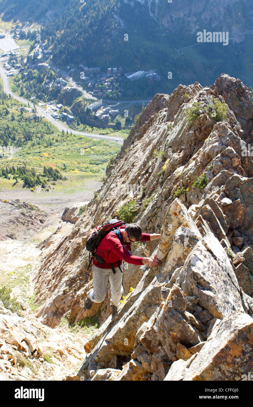 A man enjoying a fall hike on the South Ridge of Mt Superior, Utah ...