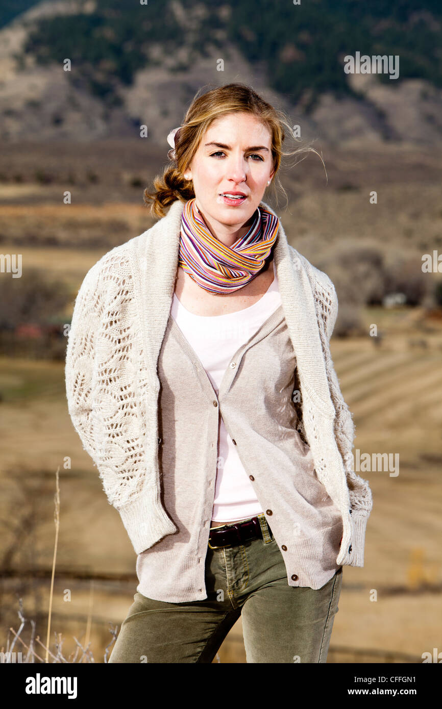 A young woman poses in layered outdoor clothing in Fort Collins ...