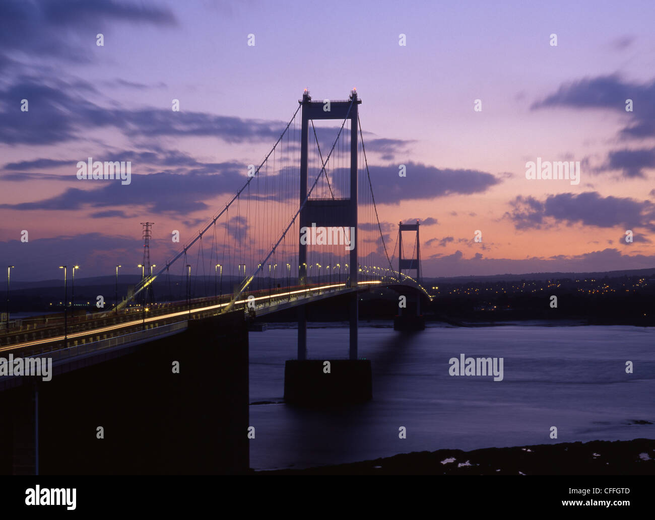 Old / original Severn Bridge carrying M48 motorway at sunset / night ...