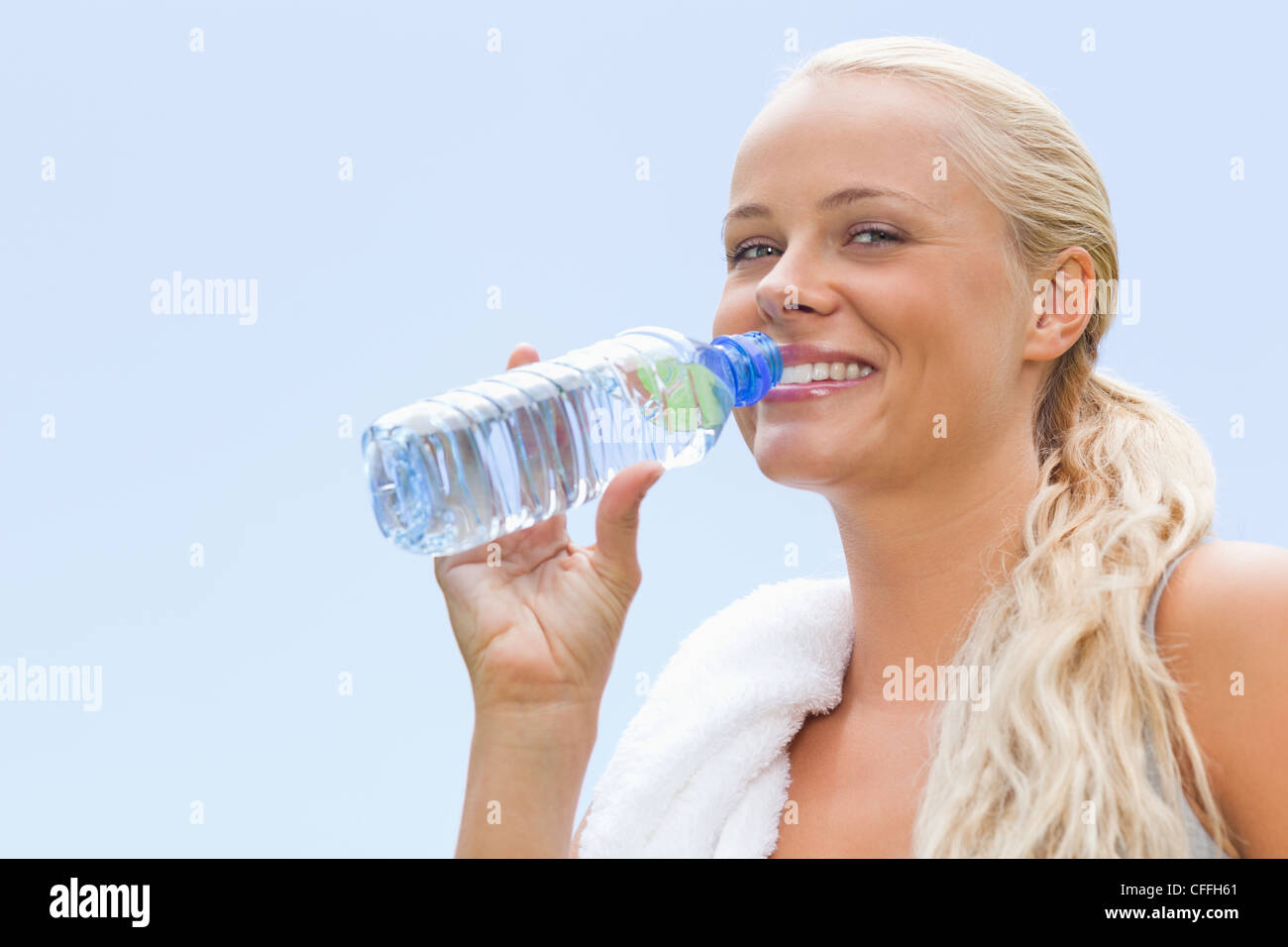 Smiling sportswoman holding towel hi-res stock photography and images ...