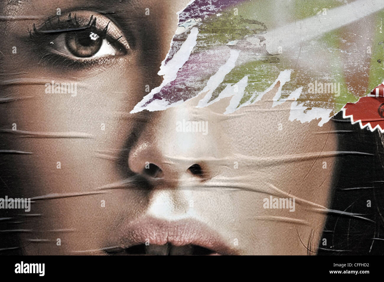 torn poster of female face Stock Photo - Alamy
