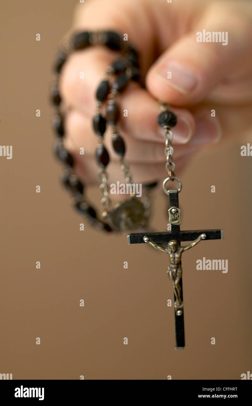 Hand Holding Rosary Stock Photo - Alamy