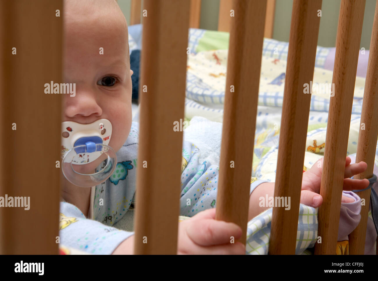 Baby Boy in Crib Stock Photo - Alamy