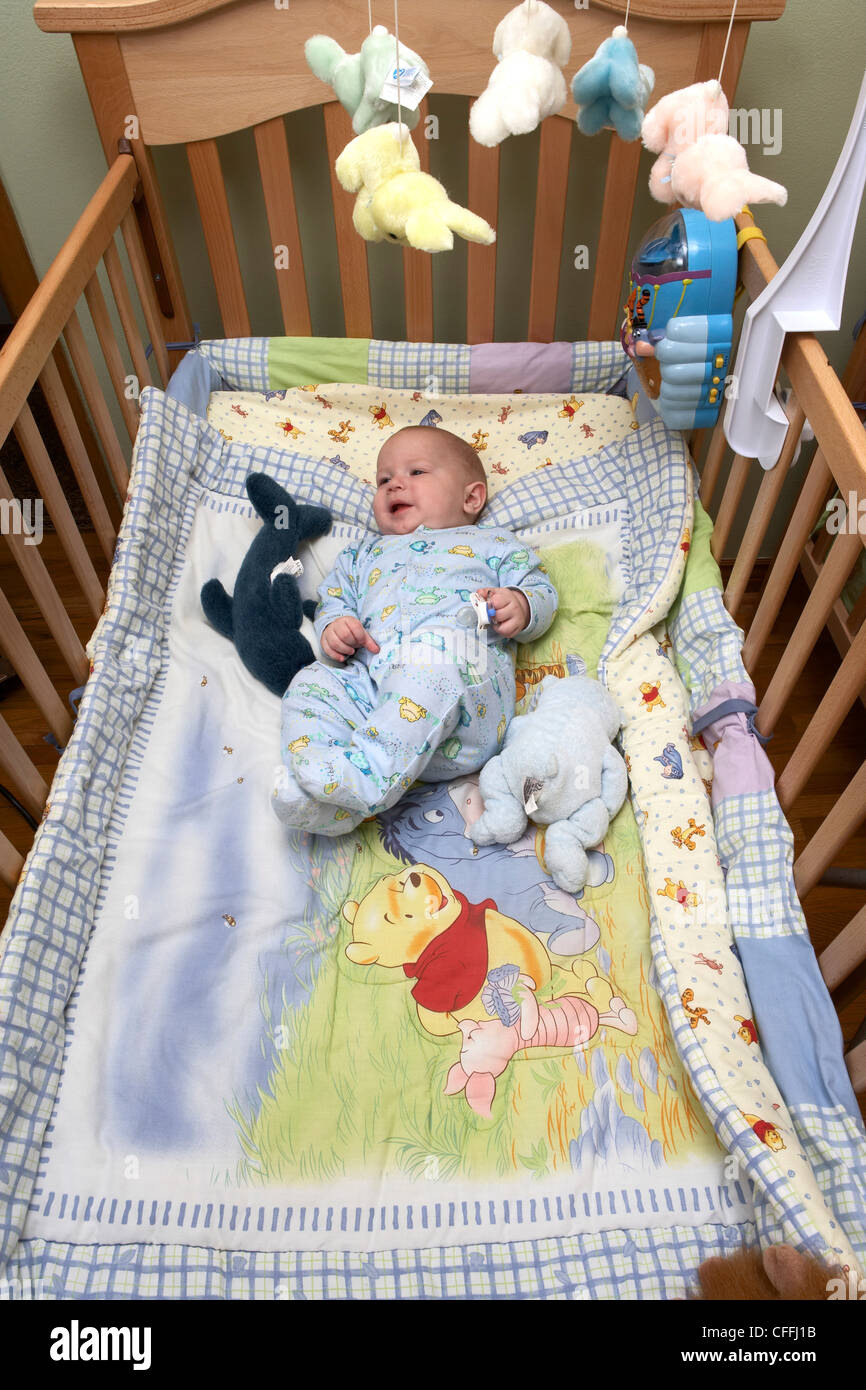 Baby Boy in Crib Stock Photo - Alamy