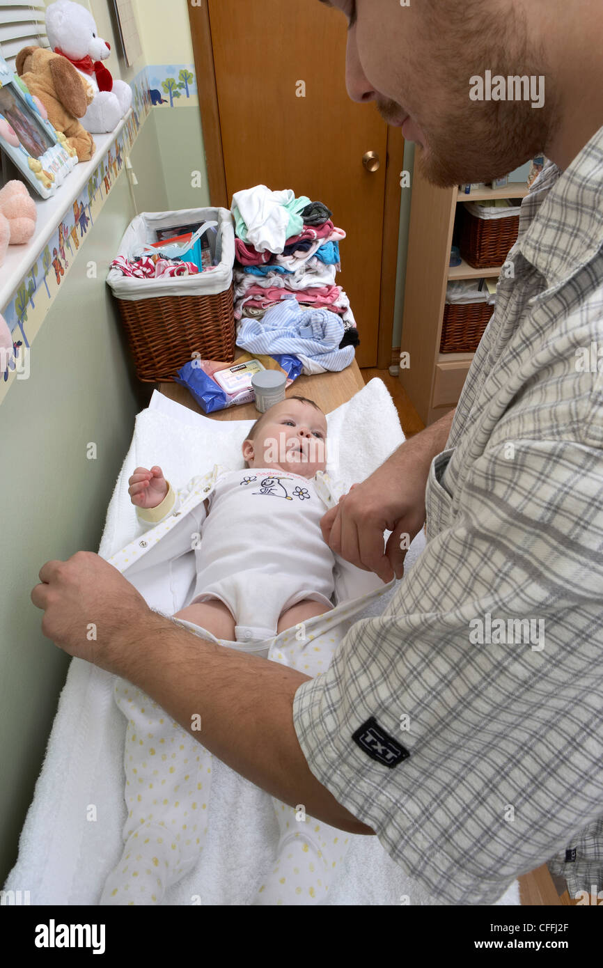 Caucasian changing baby girls diaper hi-res stock photography and ...