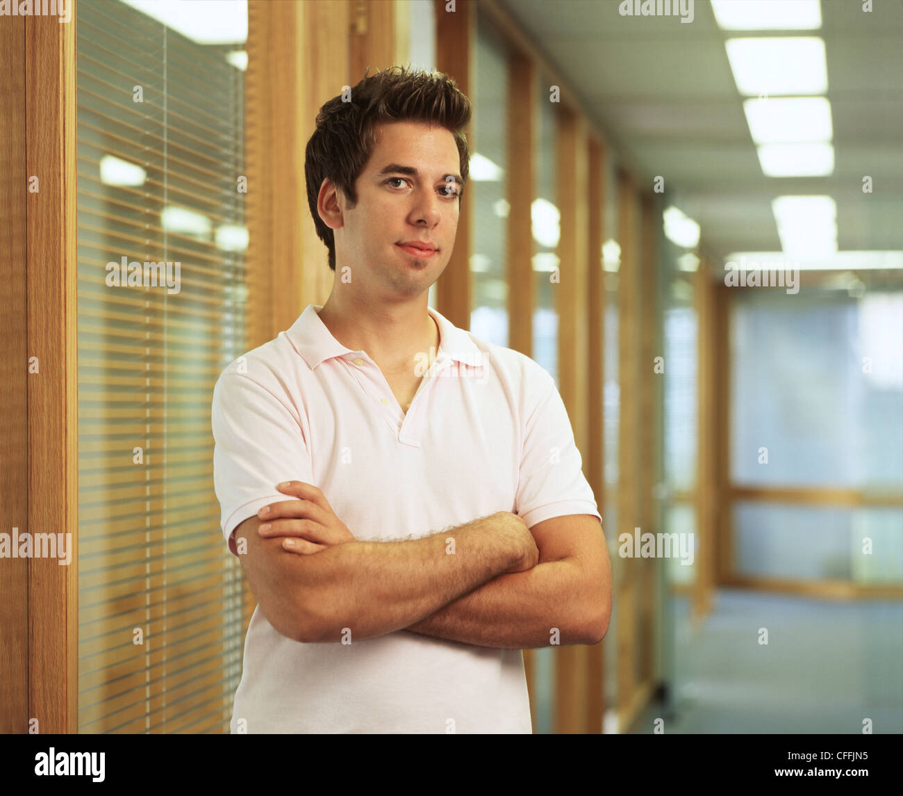 Man in Office Hallway Stock Photo - Alamy