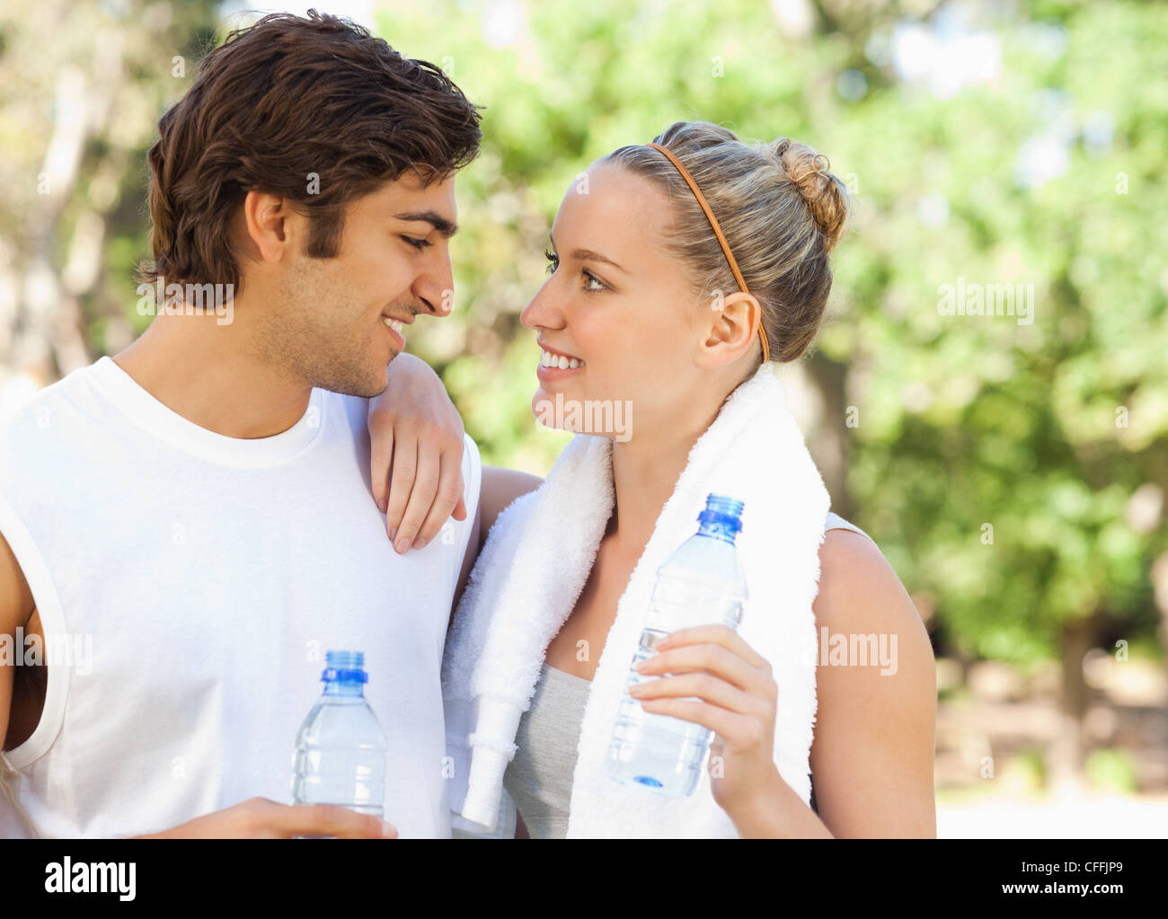 Smiling sports people in the park Stock Photo - Alamy