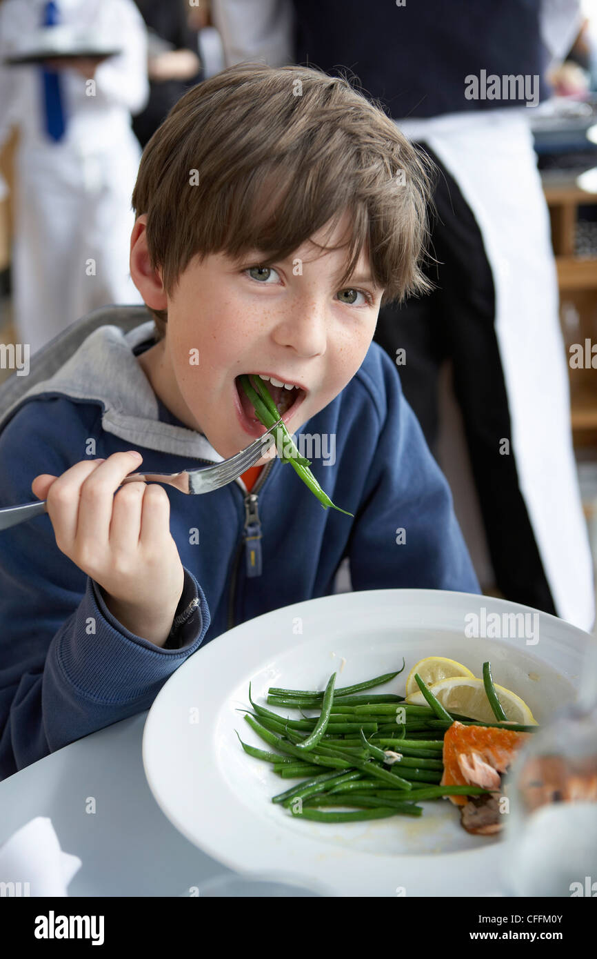 Boy Eating Green Beans Stock Photo - Alamy