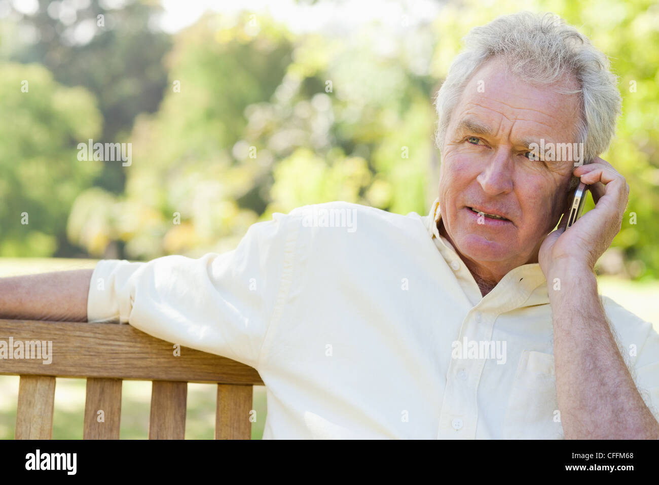 Man making a serious call on his mobile phone Stock Photo - Alamy