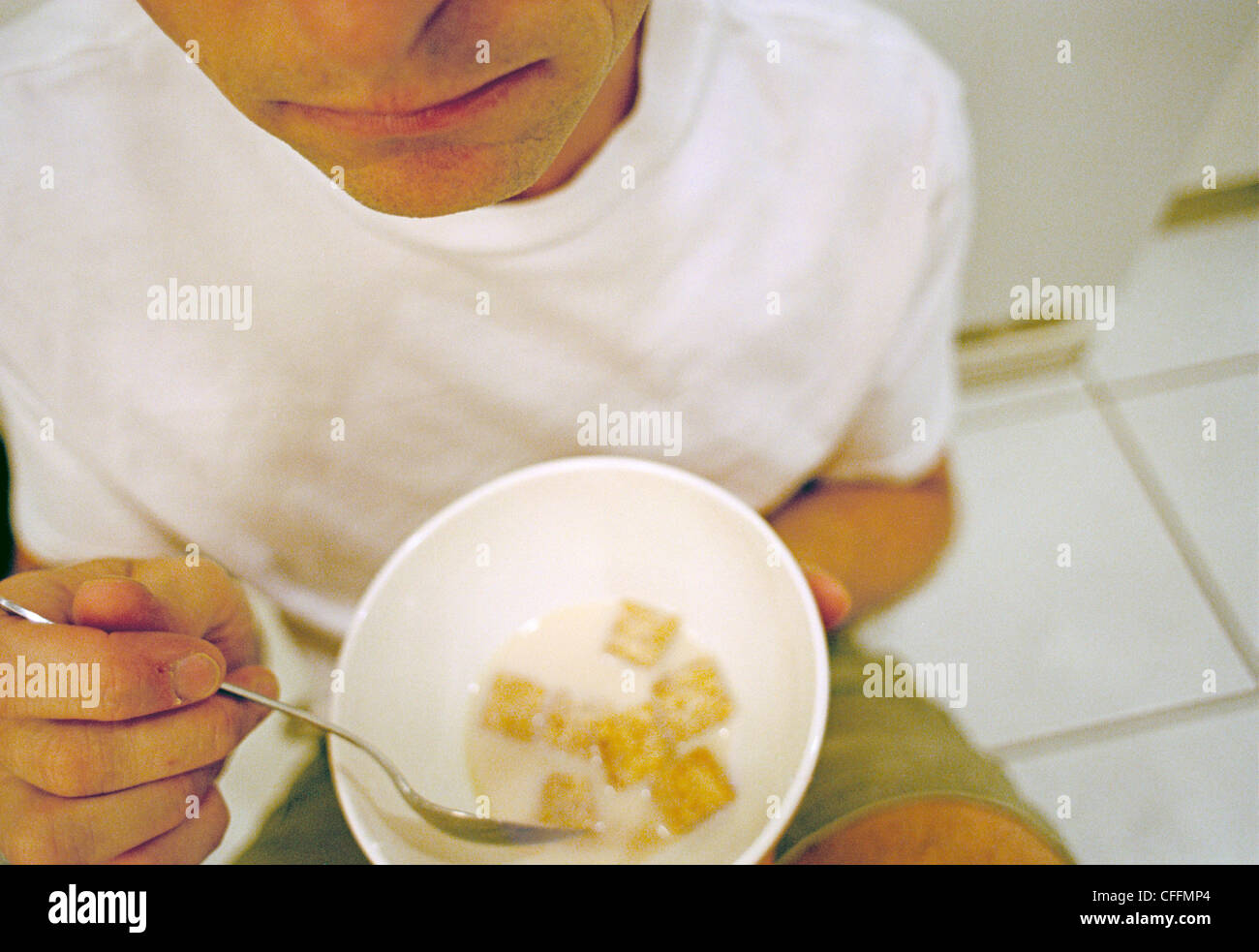 Man Eating Bowl of Cereal Stock Photo - Alamy